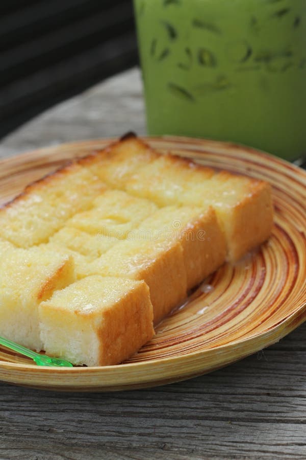 Bread, Butter, Topped Milk and Green Tea. Stock Photo - Image of piece ...