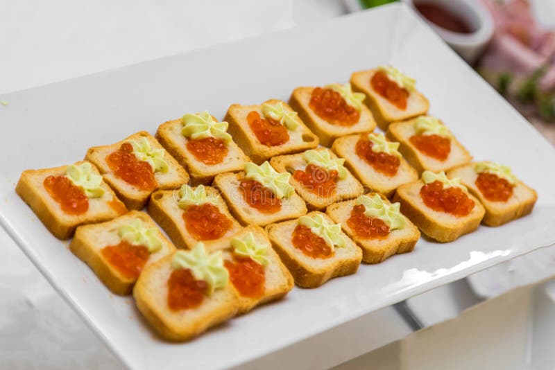 Bread with Caviar on a White Plate of the Banquet Table Stock Image ...
