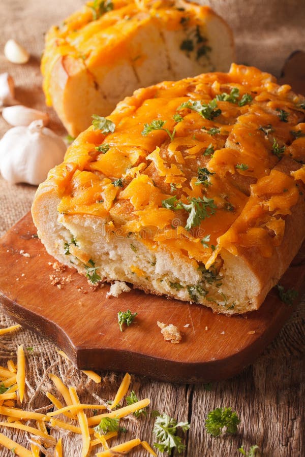 Bread with Cheddar Cheese, Garlic and Herbs Closeup. Vertical Stock ...