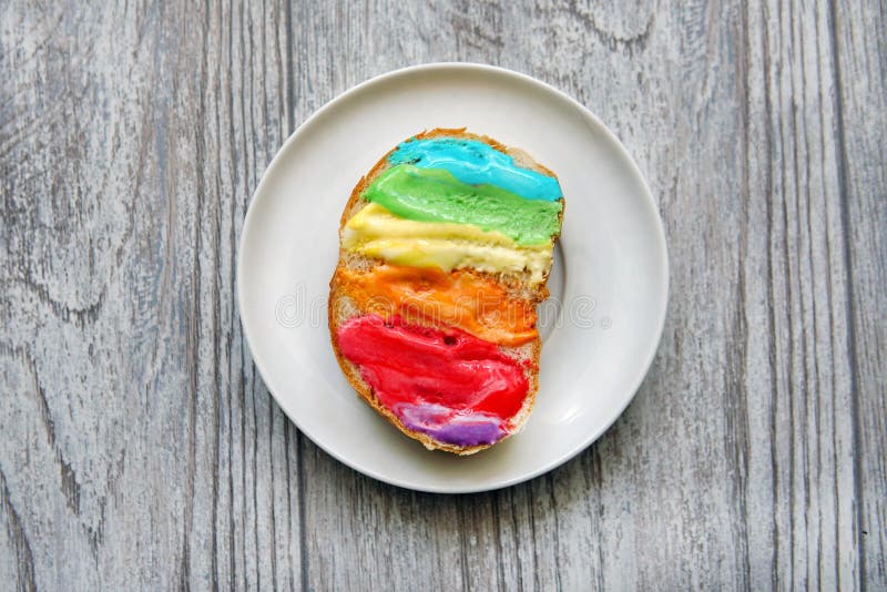 The Bread is Colorful Cream. Rainbow on Bread. Breakfast Stock Image ...