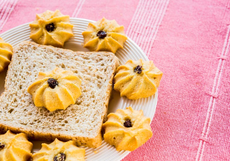 Bread and cookies on plate stock image. Image of dessert - 65826049
