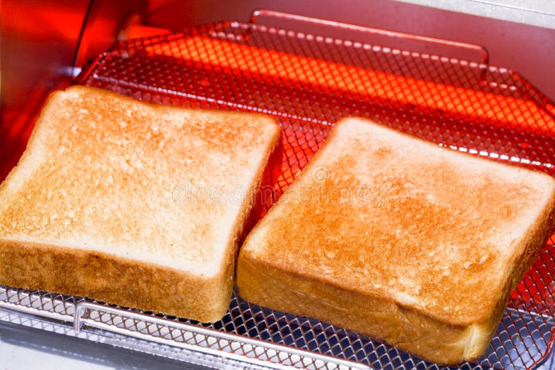 Bread Cooking in the Toaster Stock Photo - Image of isolated, household ...