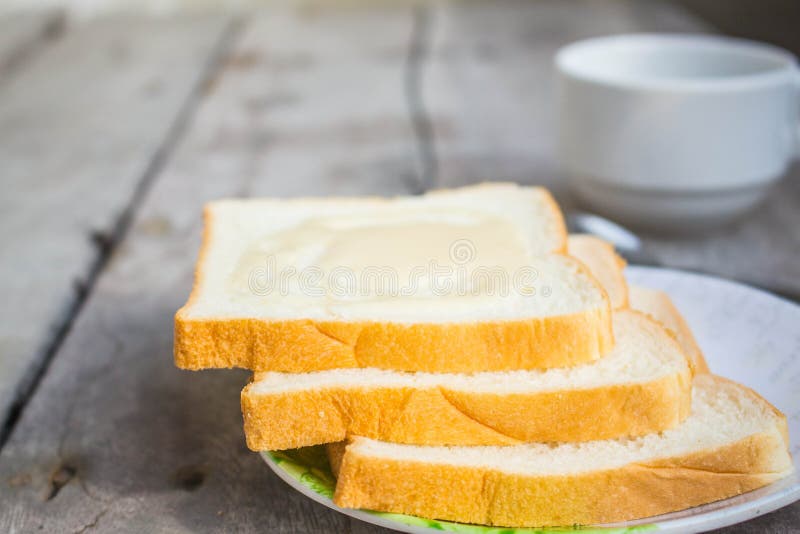 Bread and a Cup on the Wooden Stock Image - Image of dessert, bread ...
