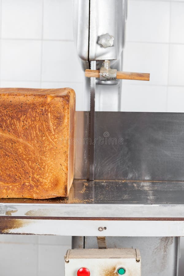 Bread on Cutting Machine in Bakery Stock Photo - Image of commercial ...