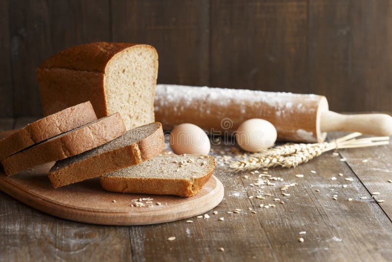 Bread on a Dark Wooden Table Stock Image - Image of baking, bakery ...