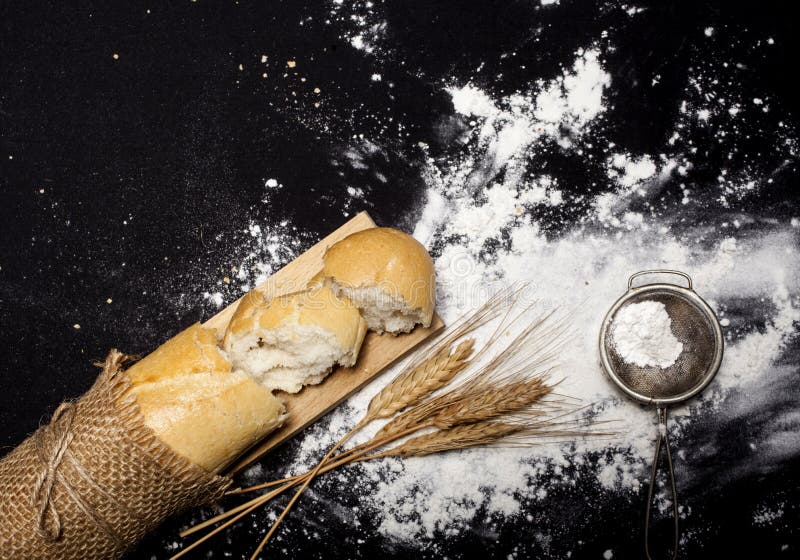 Bread and Flour on Black Table Stock Photo - Image of arranged, copy ...