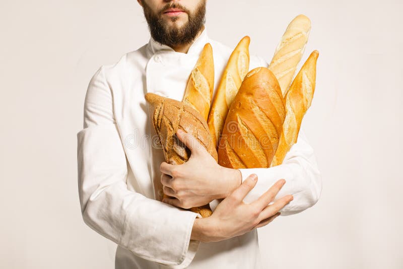 Bread in Hand. Freshly Baked Bread in the Hands of. Man with Beard ...