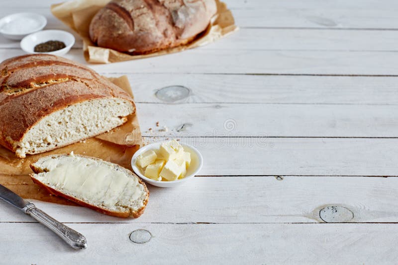 Bread loaf with butter stock photo. Image of butter - 142535052