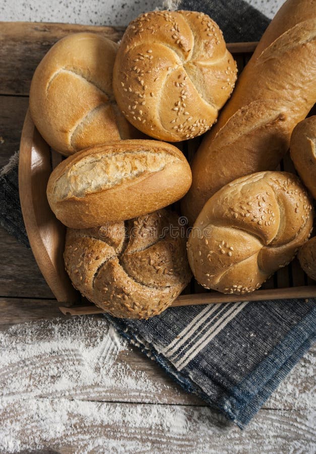 Bread and Lots of Fresh Bread Buns Stock Image - Image of flour, grains ...