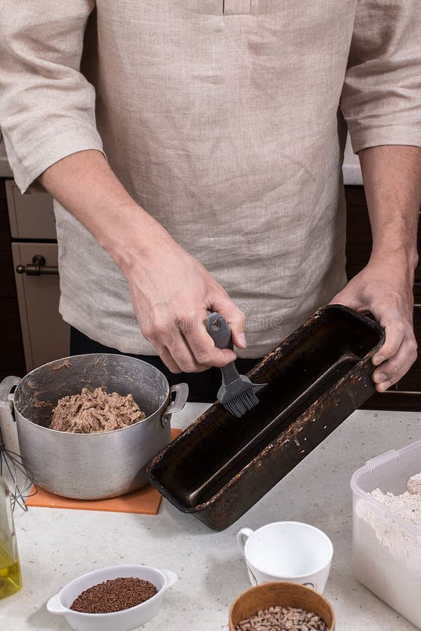 Baker Greases a Bread Baking Dish Stock Image - Image of baker, cooking ...