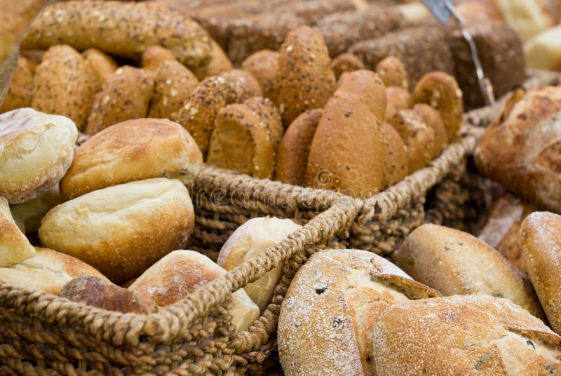 Loaves of Bread in Basket stock photo. Image of pile - 19269736