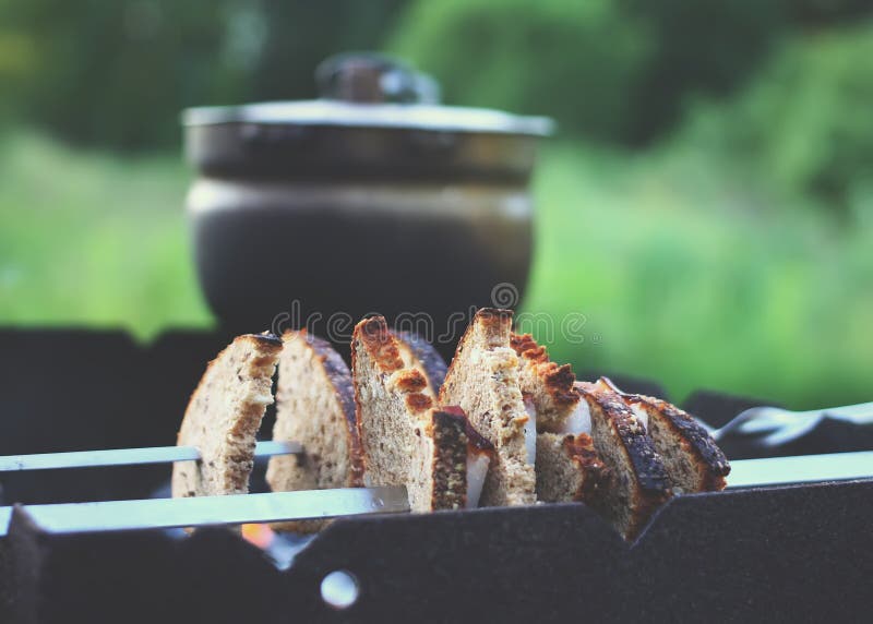 Bread and Meat on Skewer. Old Pan with Herbal Tea on Brazier. Stock ...