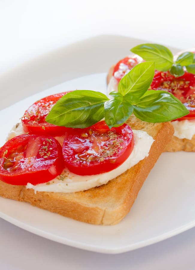 Bread with Mozzarella Tomatoes and Basil Stock Photo - Image of canape ...