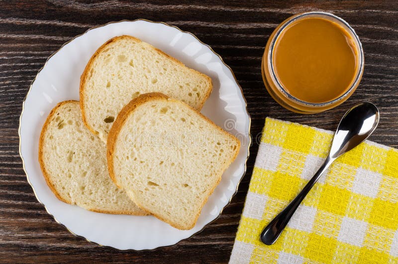 Bread in Plate, Spoon on Napkin, Jar of Peanut Paste Stock Image ...