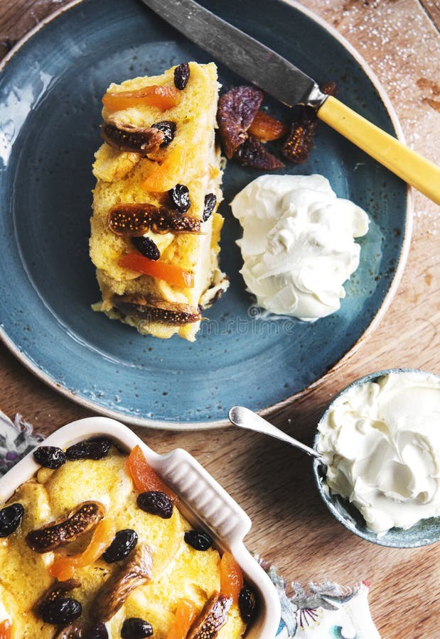 Bread Pudding with Whipped Cream on Blue Ceramic Plate Stock Image ...