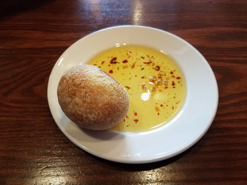 Bread Roll and Plate with Yellow Oil Stock Image - Image of oily, snack ...