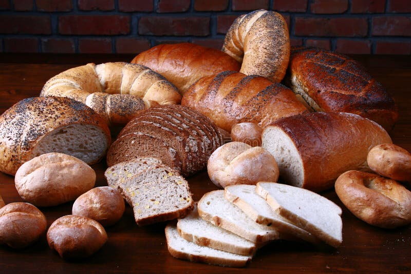 Different Kinds of Bread and Bread Rolls on Board from Above. Kitchen ...