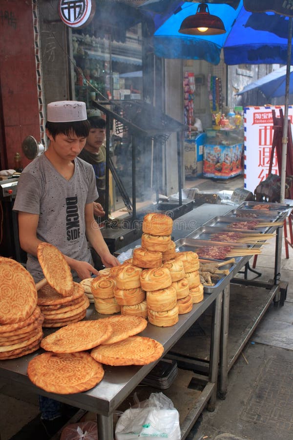 Bread seller in Xi an editorial stock image. Image of islam - 26416954