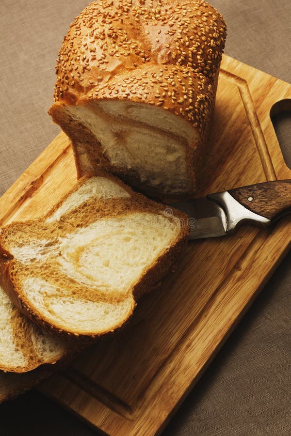 Bread Sliced on the Cutting Board Stock Photo - Image of backgrounds ...