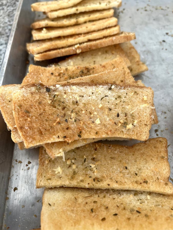 Bread Slices with Butter and Toasted on White Marble Kitchen Table ...