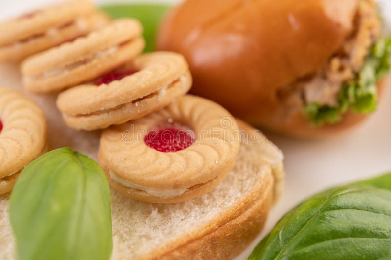 Bread Slices, Stuffed Buns, and Burgers on a White Plate Stock Image ...