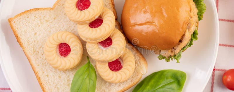 Bread Slices, Stuffed Buns, and Burgers on a White Plate Stock Image ...