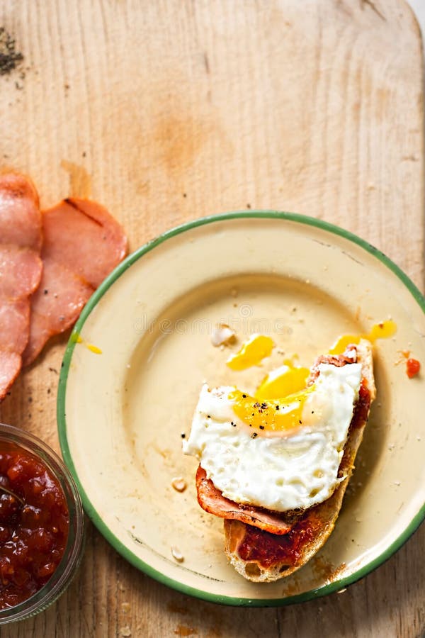 Bread Slices with Tomato Relish, Turkey Rasher and Fried Egg Stock ...
