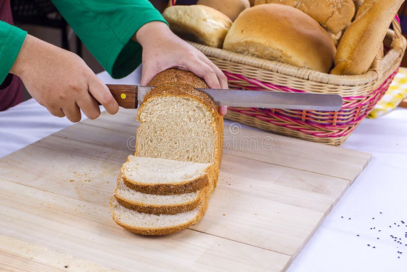 Man Slicing Bread Behind The Counter Of A Sandwich Bar Stock Image ...