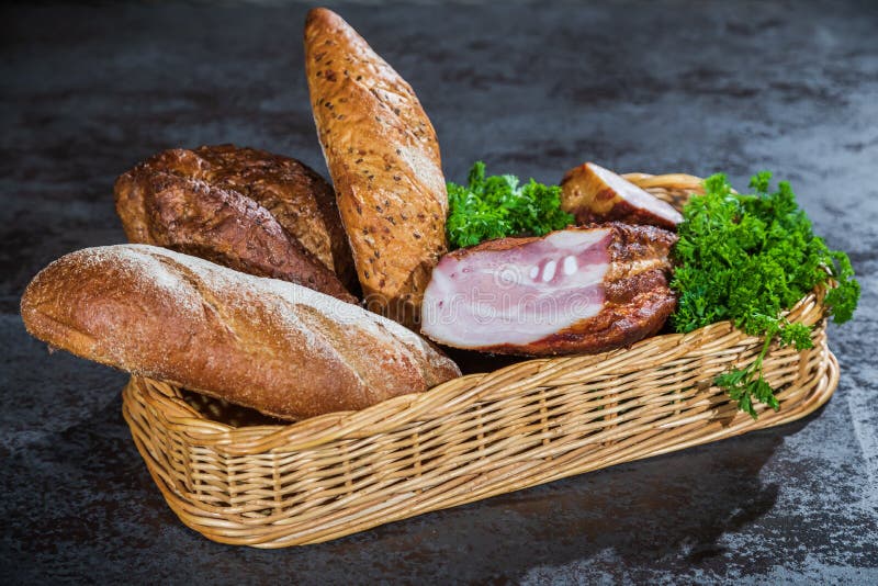 Bread and Smoked Meat in a Braided Basket on the Table. Stock Photo ...