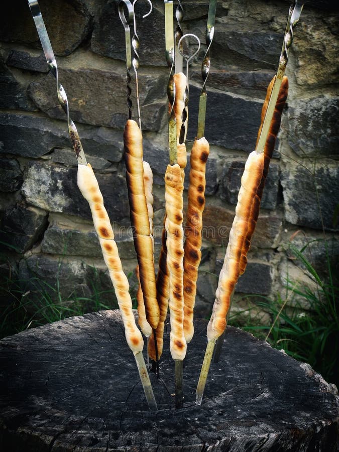 Bread Sticks of Dough Cooked on a Fire Stock Photo - Image of grilled ...