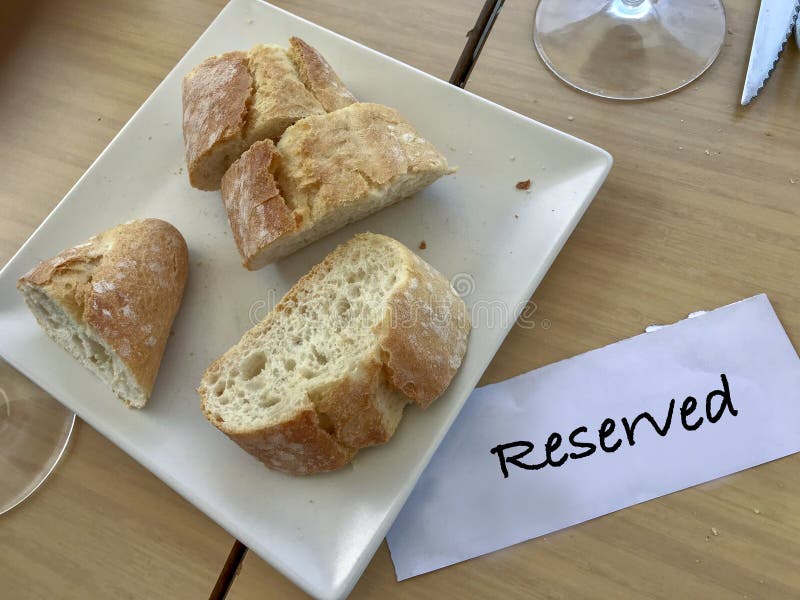 Bread on the Table with the Reserved Sign Stock Photo - Image of sign ...