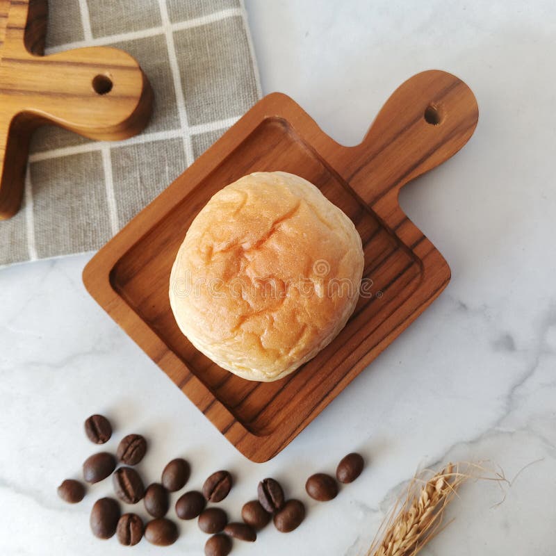 Bread on Teak Wood Stand on White Table with Coffee Beans Stock Image ...