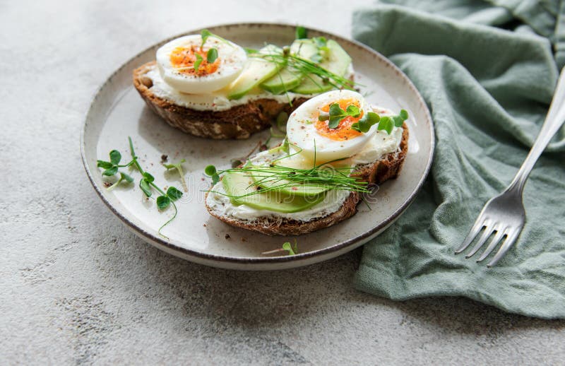 Bread Toast, Boiled Eggs, Avocado Slice, Microgreens on a Plate Stock ...