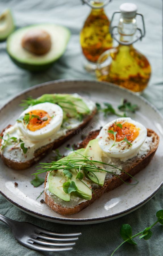 Bread Toast, Boiled Eggs, Avocado Slice, Microgreens on a Plate Stock ...