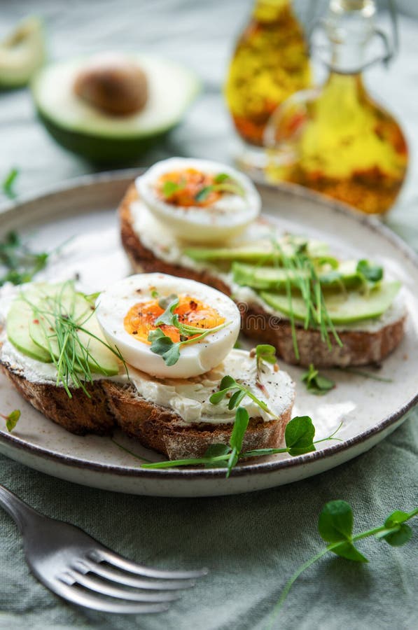 Bread Toast, Boiled Eggs, Avocado Slice, Microgreens on a Plate Stock ...