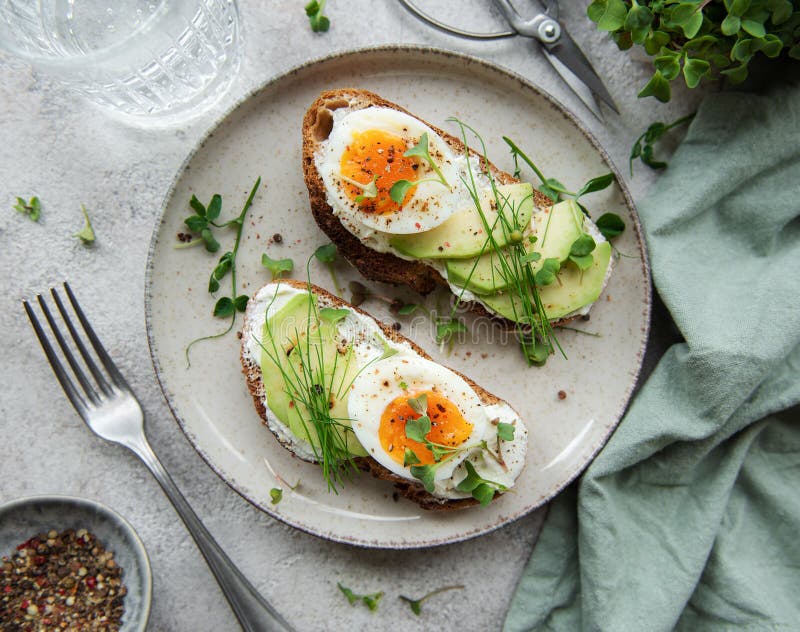 Bread Toast, Boiled Eggs, Avocado Slice, Microgreens on a Plate Stock ...