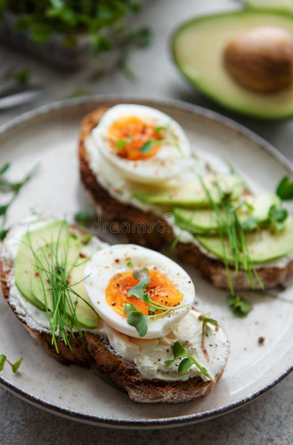 Bread Toast, Boiled Eggs, Avocado Slice, Microgreens on a Plate Stock ...