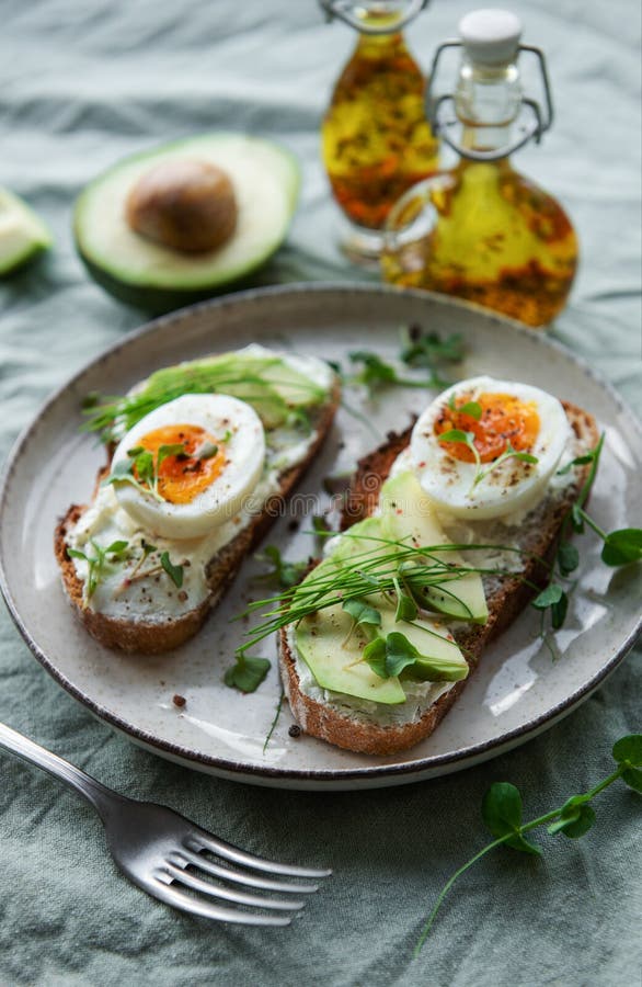 Bread Toast, Boiled Eggs, Avocado Slice, Microgreens on a Plate Stock ...