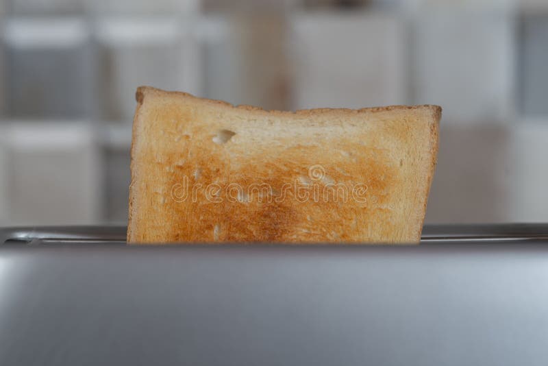 Bread in the Toaster on Wooden Desk. Kitchenware Stock Photo - Image of ...
