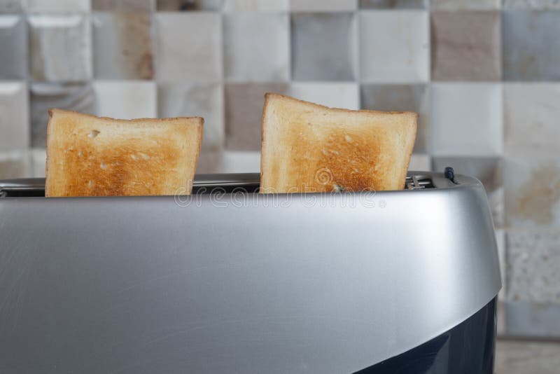 Bread in the Toaster on Wooden Desk. Kitchenware Stock Photo - Image of ...