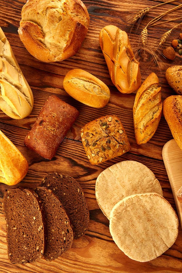 Bread Varied Mix on Golden Aged Wood Table Stock Image - Image of fiber ...