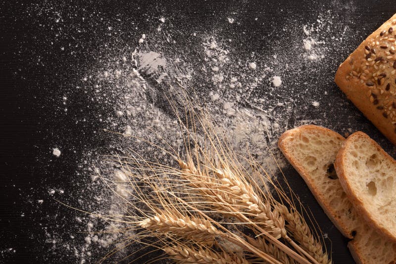 Bread Wheat and Flour on Black Table Top View Stock Image - Image of ...
