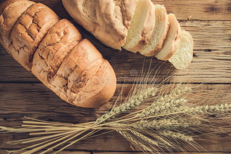 Bread and Wheat on the Table Stock Image - Image of natural, loaf ...
