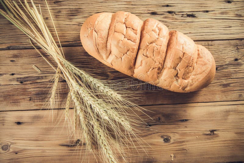 Bread and Wheat on the Table Stock Image - Image of food, grain: 267812263