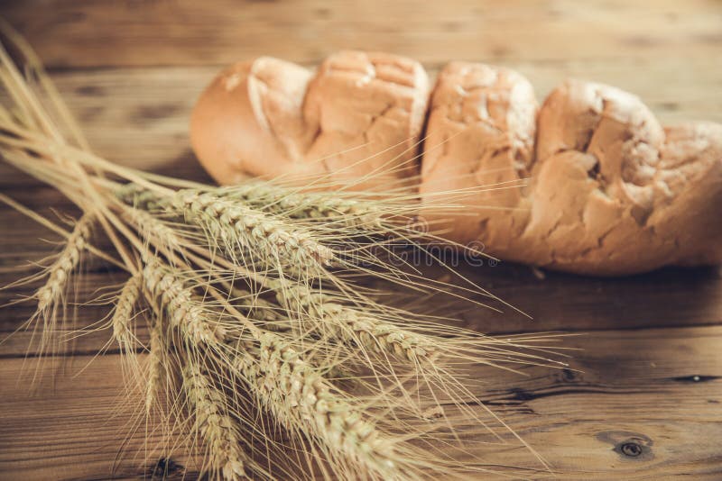 Bread and Wheat on the Table Stock Photo - Image of wheat, food: 268180188
