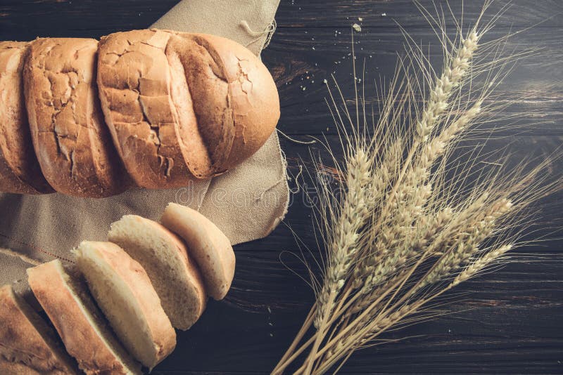 Bread and Wheat on the Table Stock Photo - Image of brown, gourmet ...