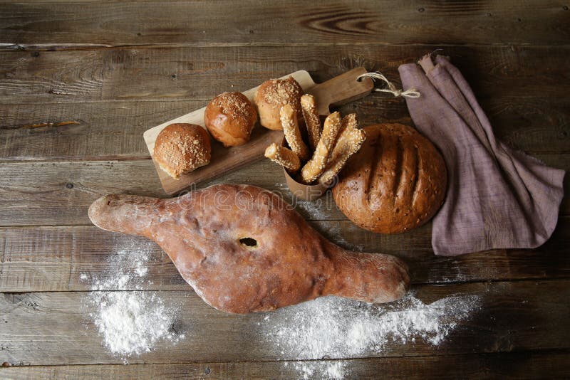 Bread on a Wooden Rustic Table, Bread Buns on a Wooden Board and Bread ...