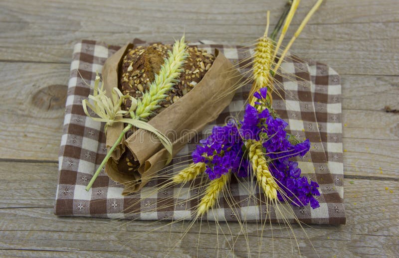 Bread Wrapped in Paper with Spikelets of Wheat Stock Photo - Image of ...