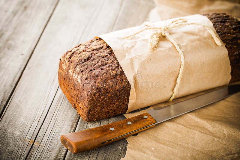 Bread wrapped in paper stock image. Image of brown, breakfast - 47929645