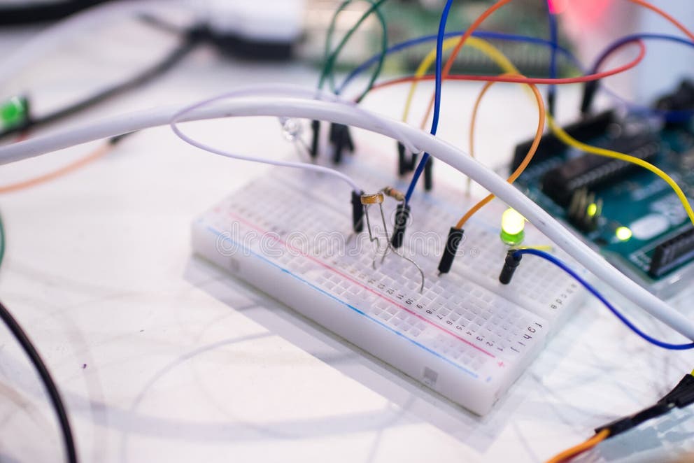 Breadboard and Microcontroller with Circuit and Light Sensor. ST Stock ...